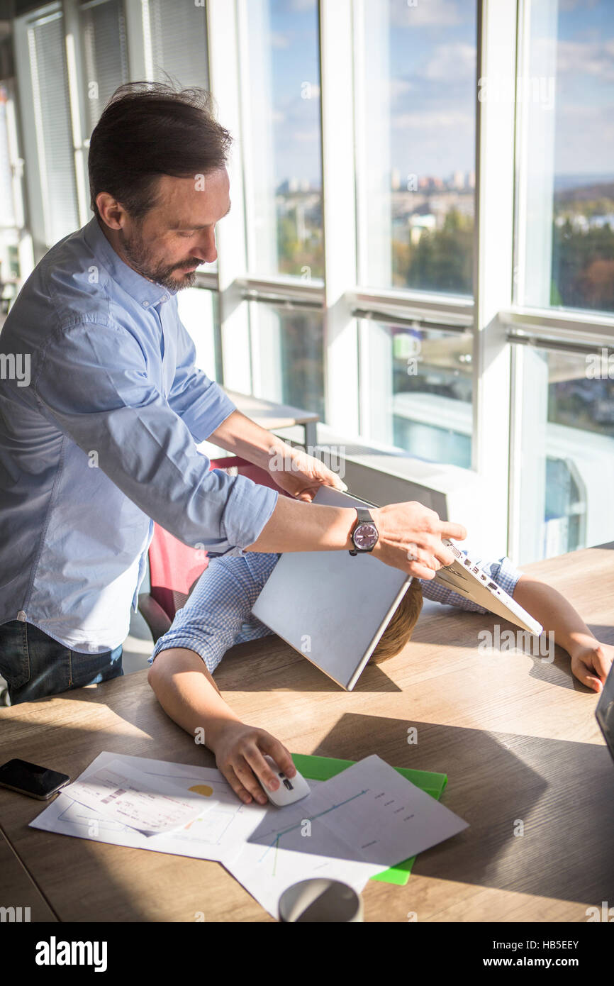 Businessman joking during work Stock Photo - Alamy