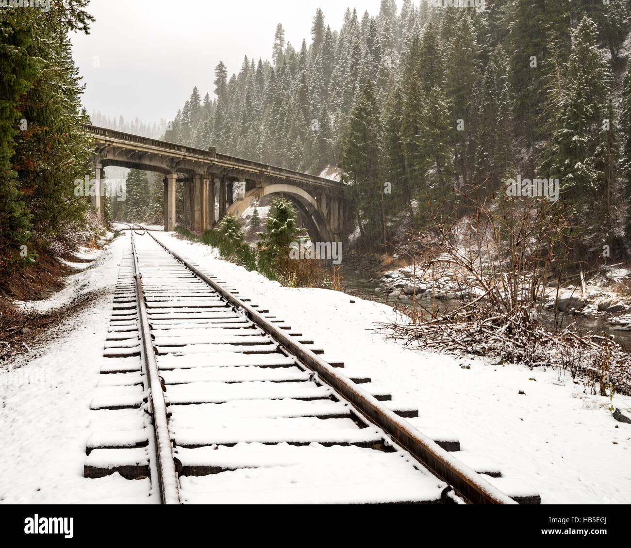 Iconic Idaho bridge with snow falling and railroad tracks Stock Photo ...