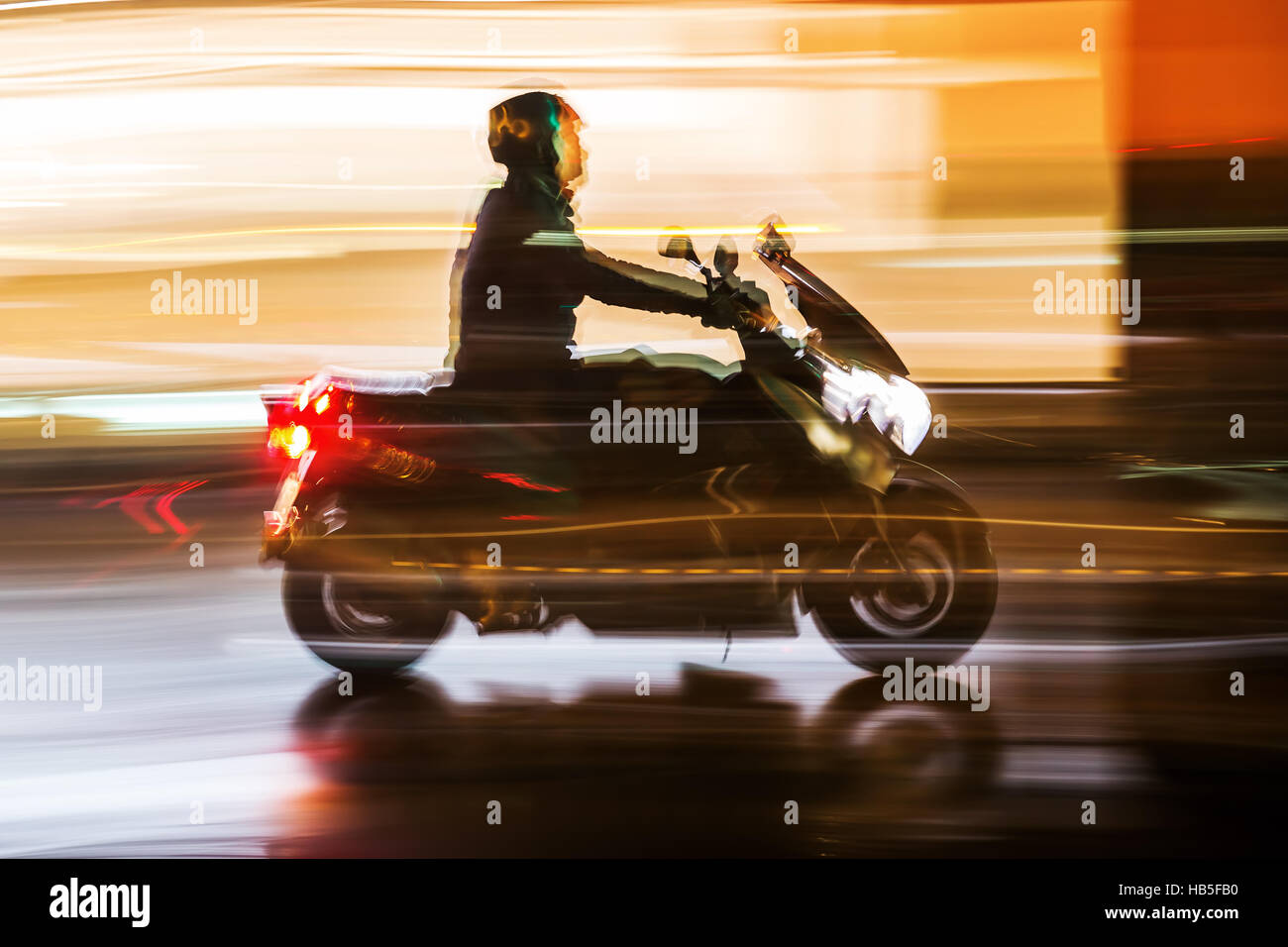 picture with camera made motion blur effect of a motorcycle rider at ...