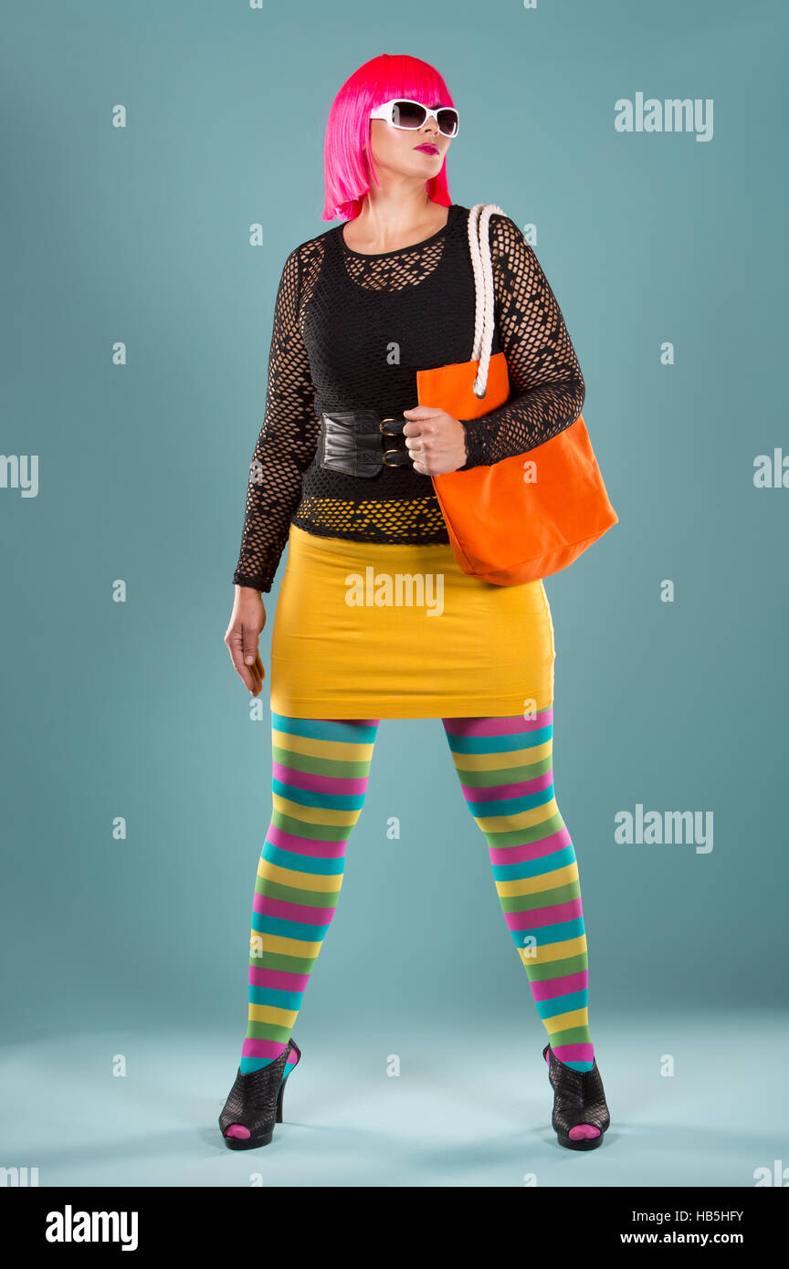 fashion woman in bright outfit Stock Photo - Alamy