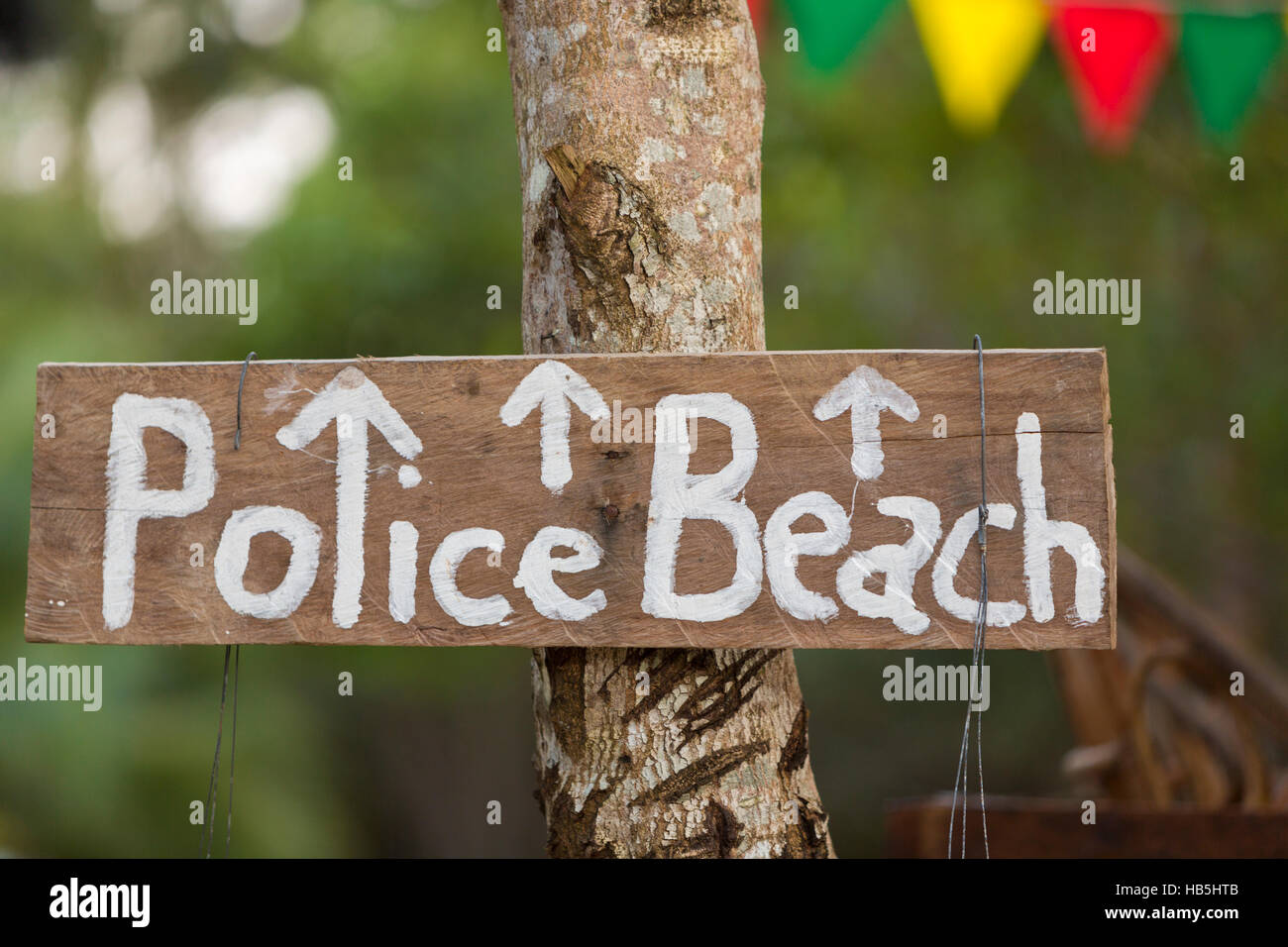Police beach wooden sign hanging on a tree on Koh Rong Island Stock ...