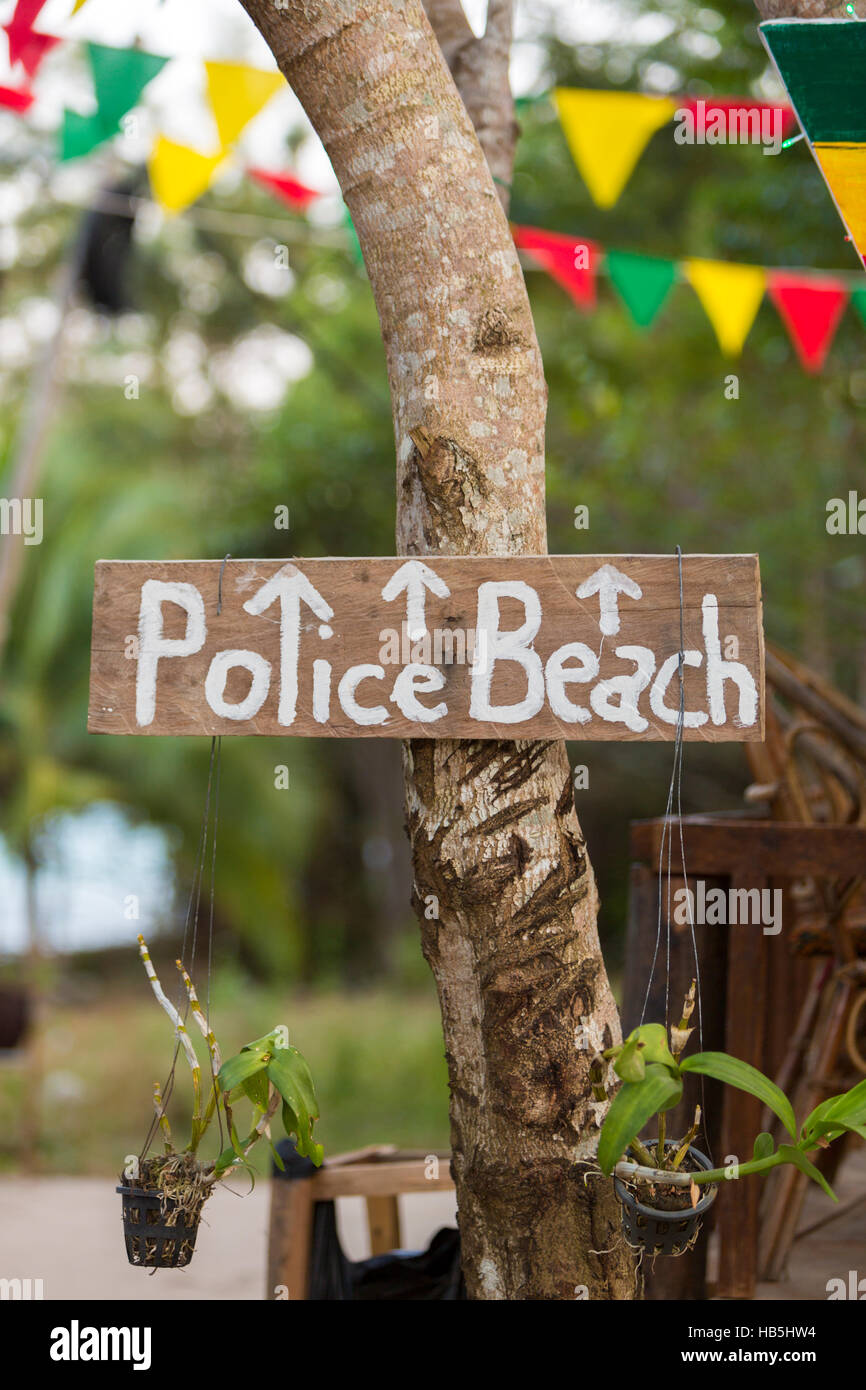 Police beach wooden sign hanging on a tree on Koh Rong Island Stock ...