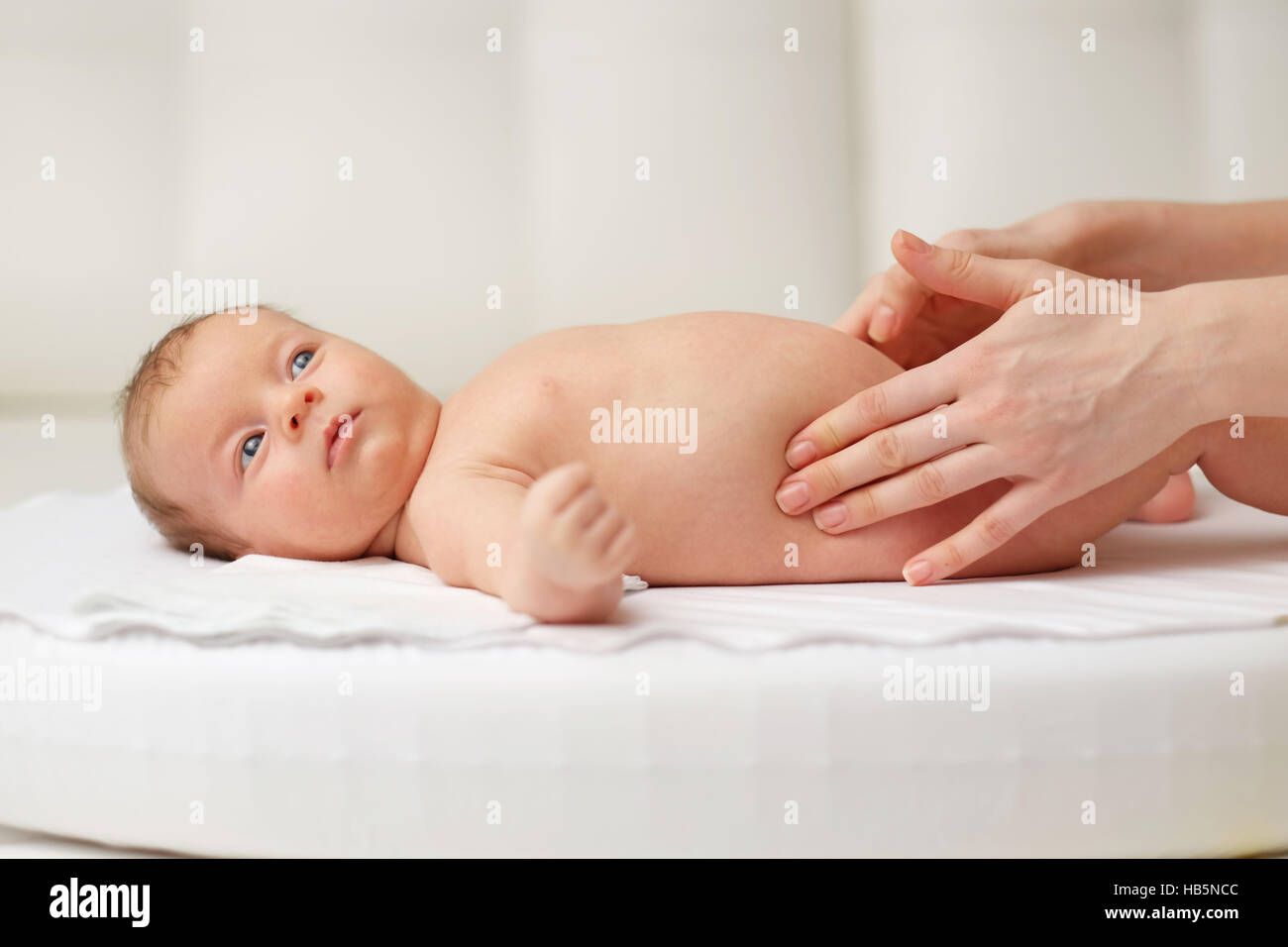 Newborn baby massage Stock Photo - Alamy