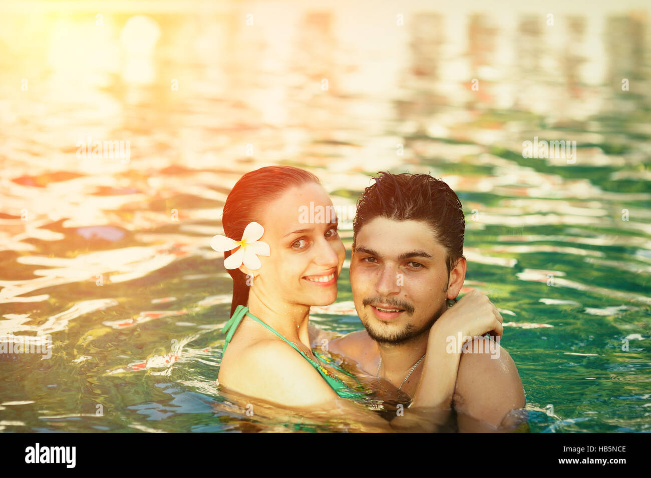Couple in pool Stock Photo - Alamy