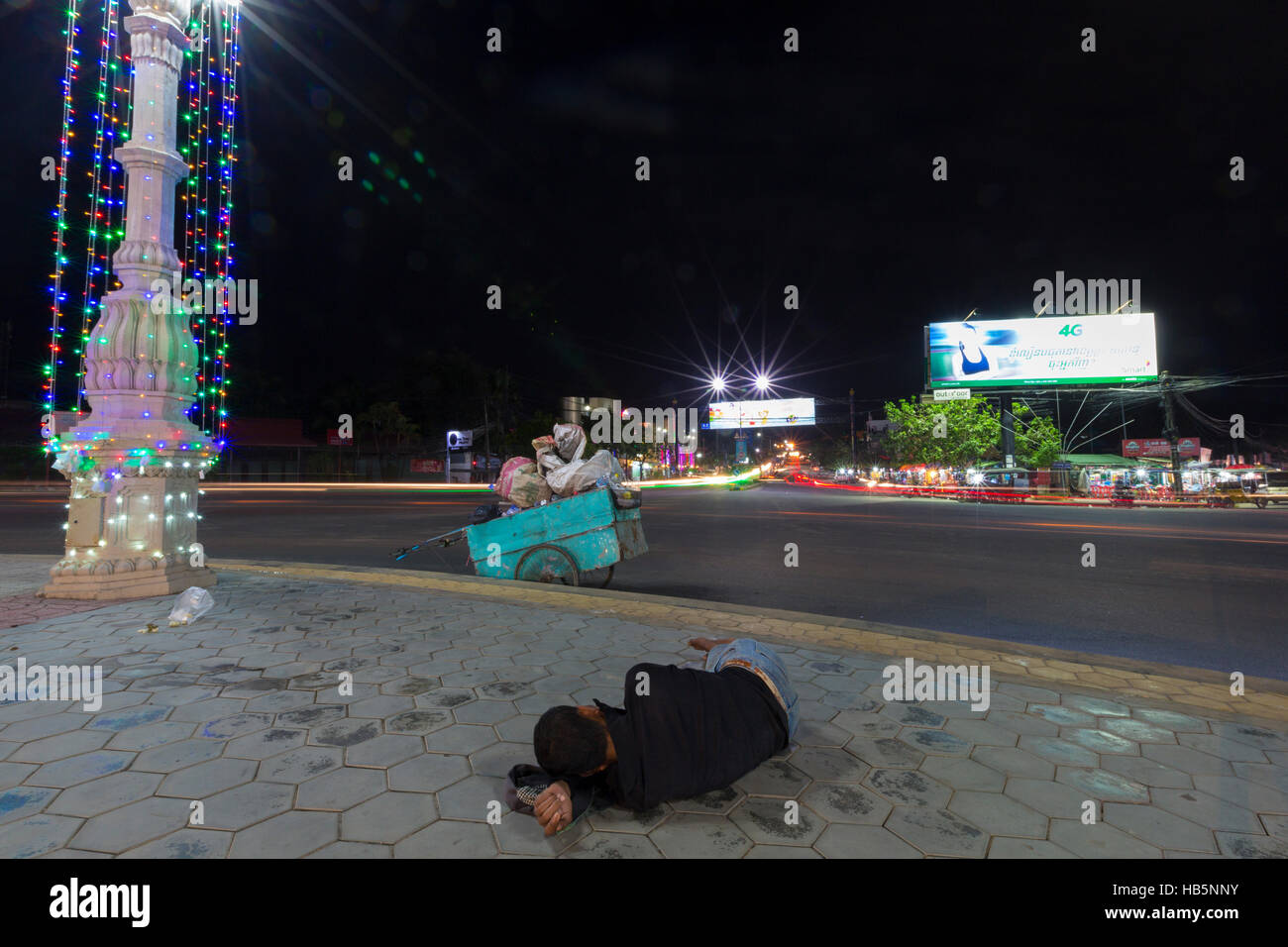 Poor sleeper on the ground at night in Sihanoukville, Poverty in ...