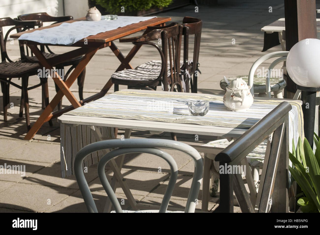 Tables and chairs of street cafe Stock Photo - Alamy
