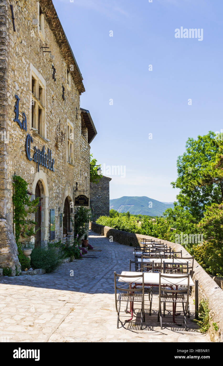 Tables and chairs outside a restaurant in the medieval village of ...