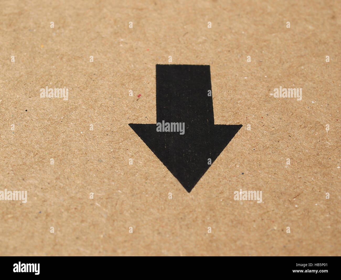 Black arrow on cardboard Stock Photo - Alamy