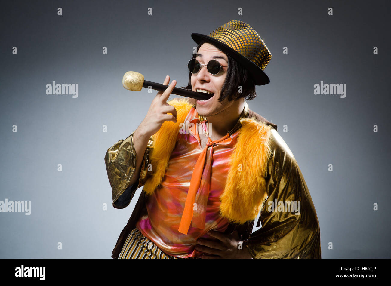 Young man singing in karaoke club Stock Photo - Alamy
