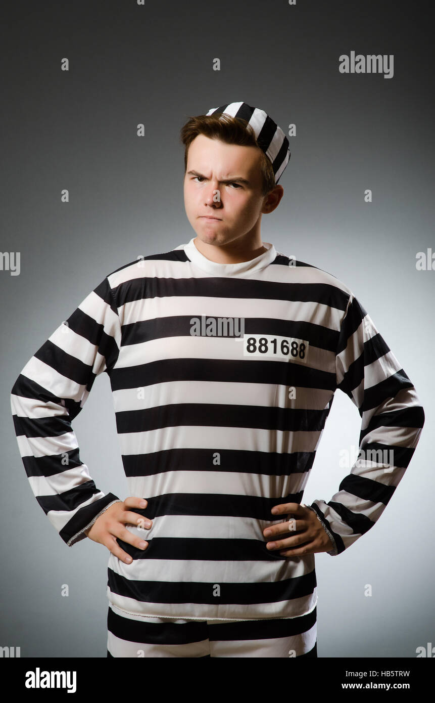 Funny prisoner in prison concept Stock Photo - Alamy