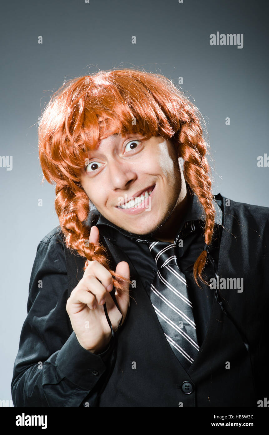 Funny man with red hair wig Stock Photo - Alamy