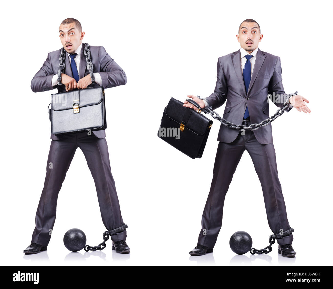 Businessman with shackles on white Stock Photo - Alamy