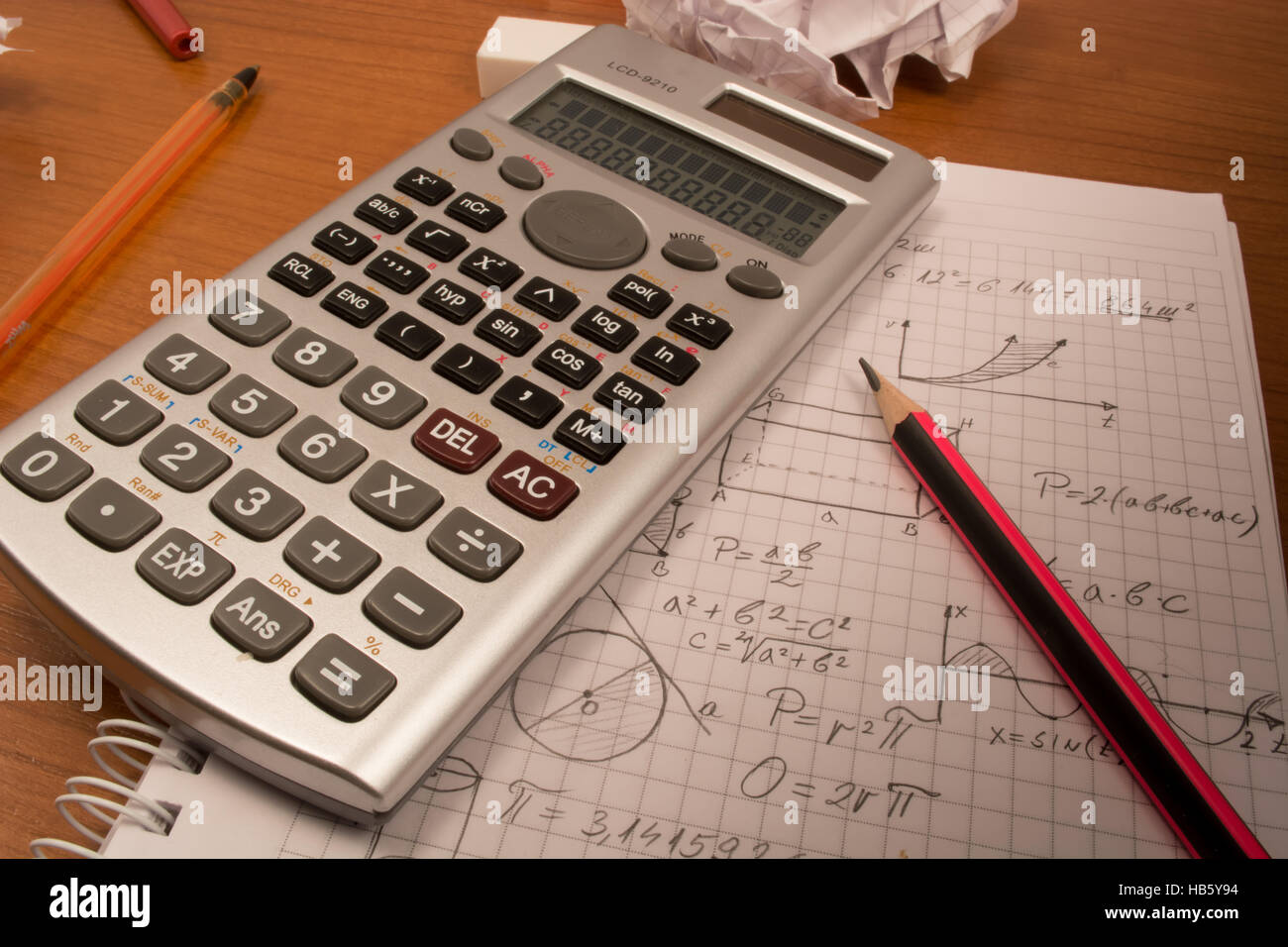 Calculator with pencil and eraser Stock Photo - Alamy