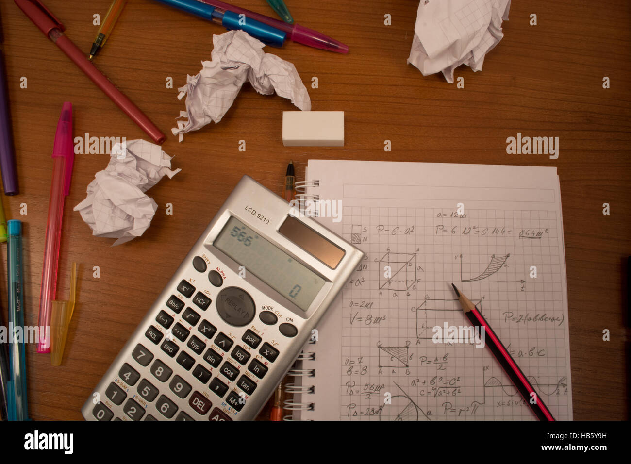 Calculator with pencil and eraser Stock Photo - Alamy