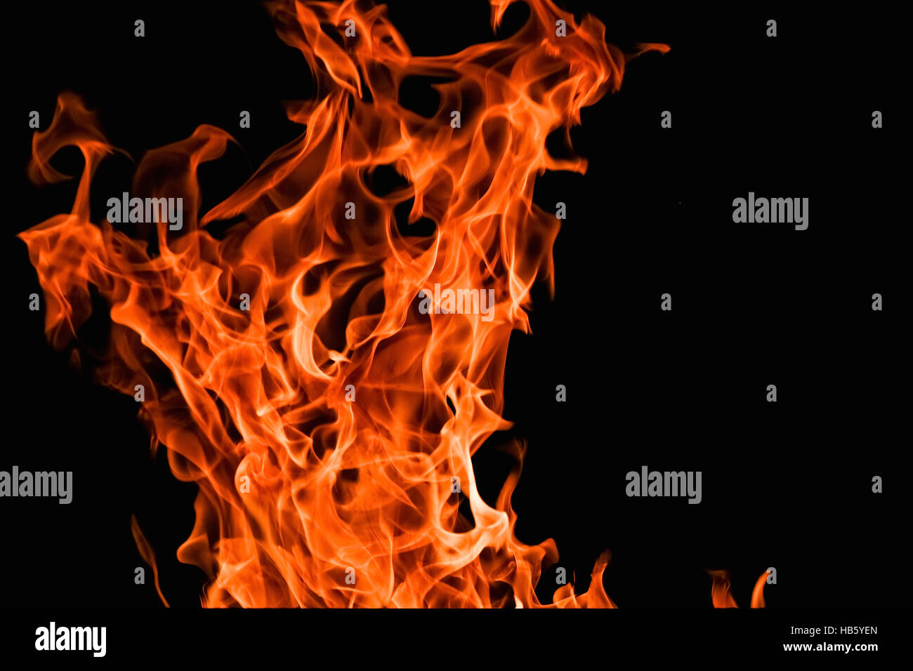 raging flames red fire black background Stock Photo - Alamy