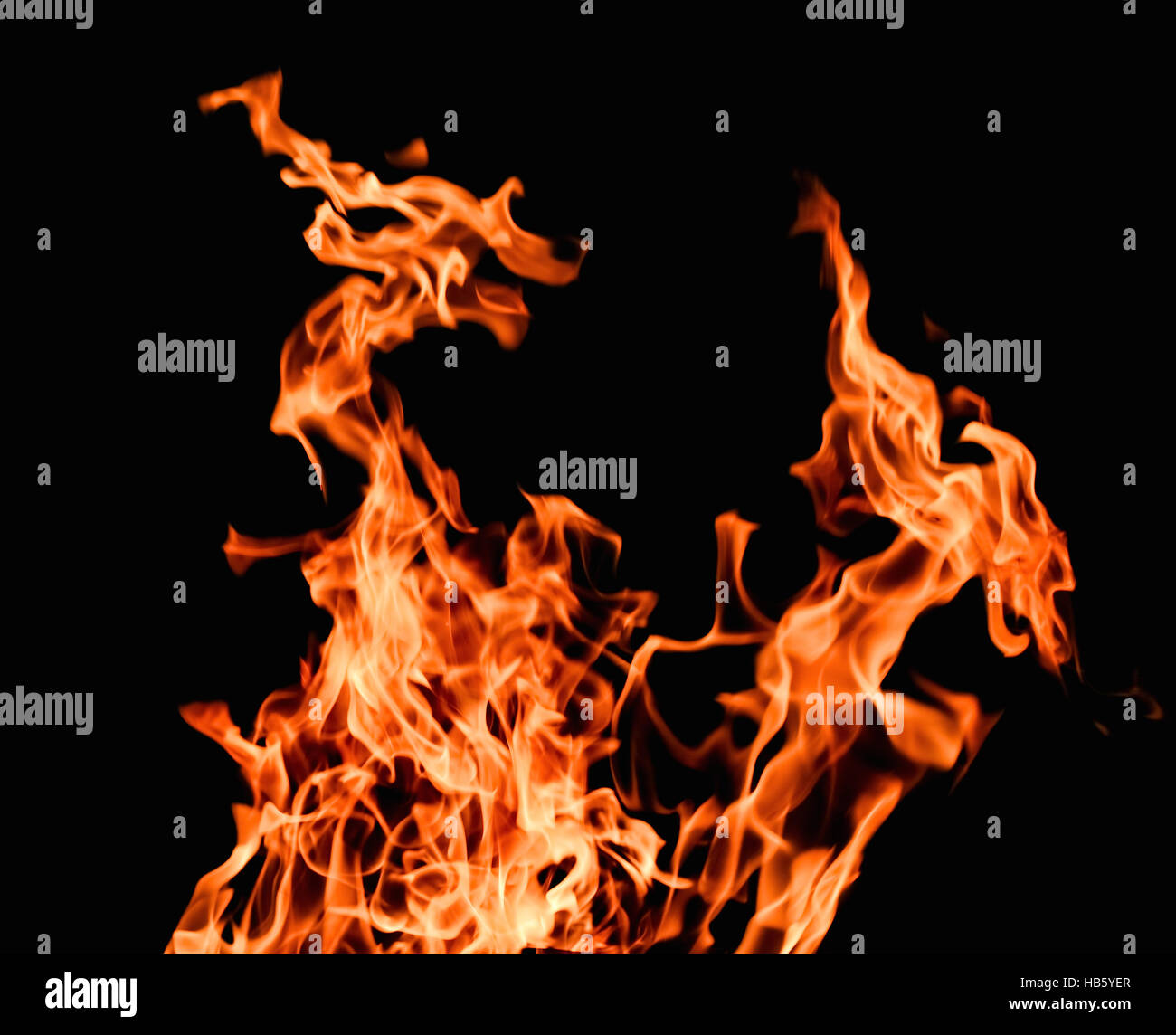 raging flames red fire black background Stock Photo - Alamy