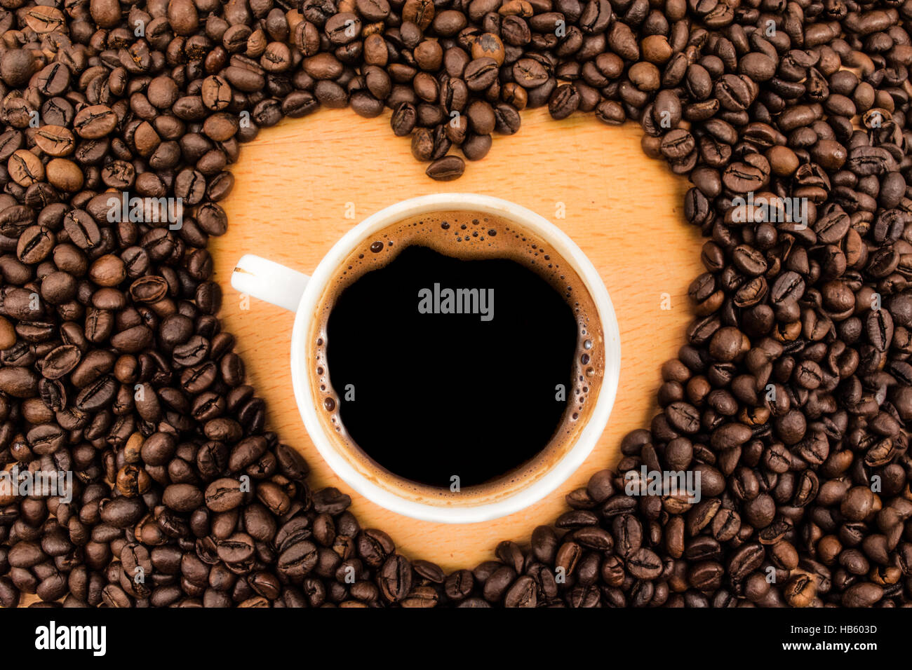 Coffee cup in heart Stock Photo - Alamy