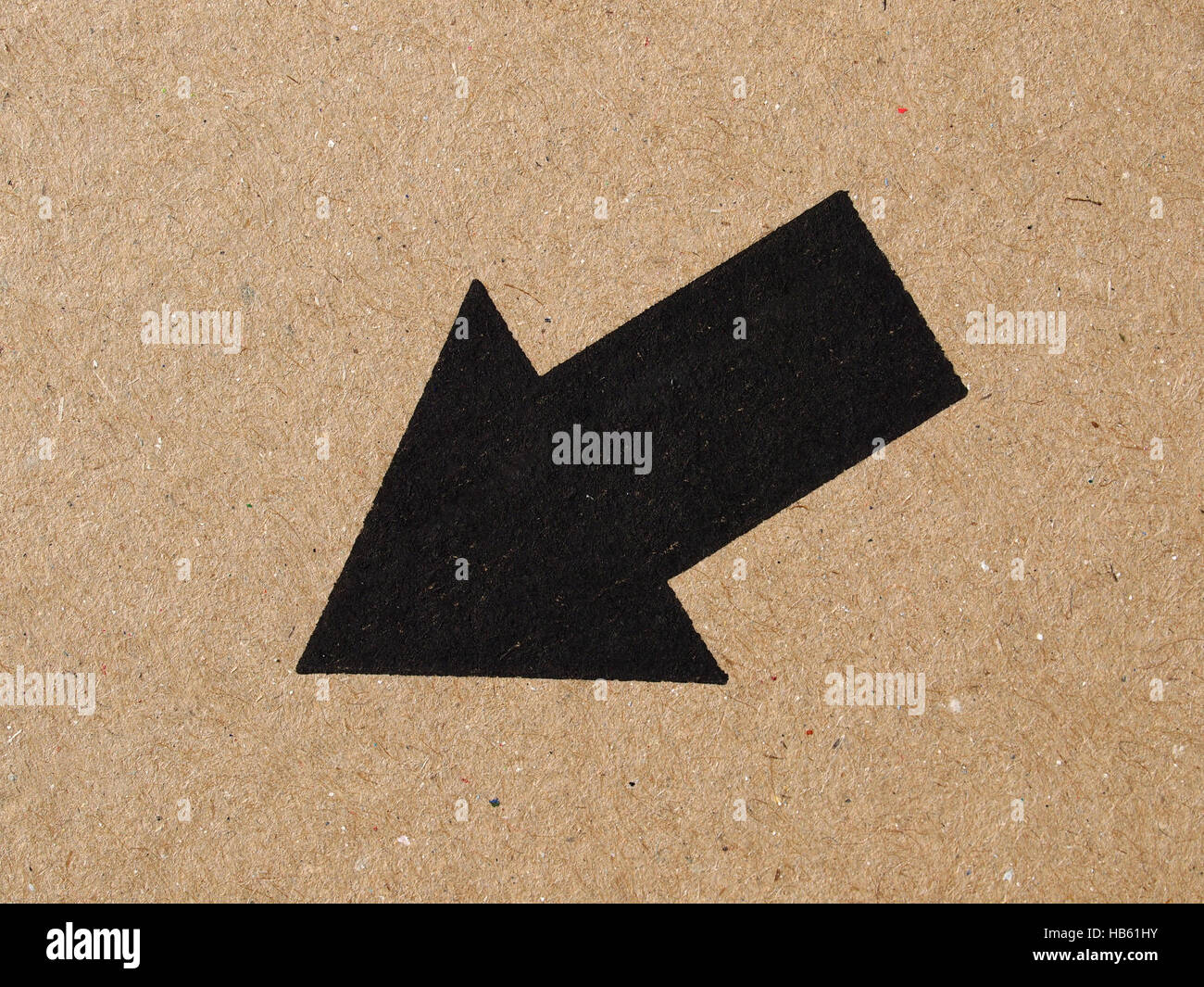 Black arrow on cardboard Stock Photo - Alamy