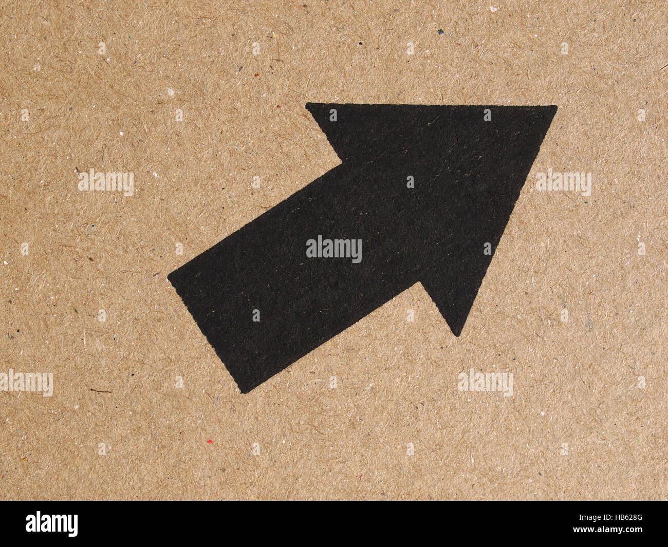 Black arrow on cardboard Stock Photo - Alamy