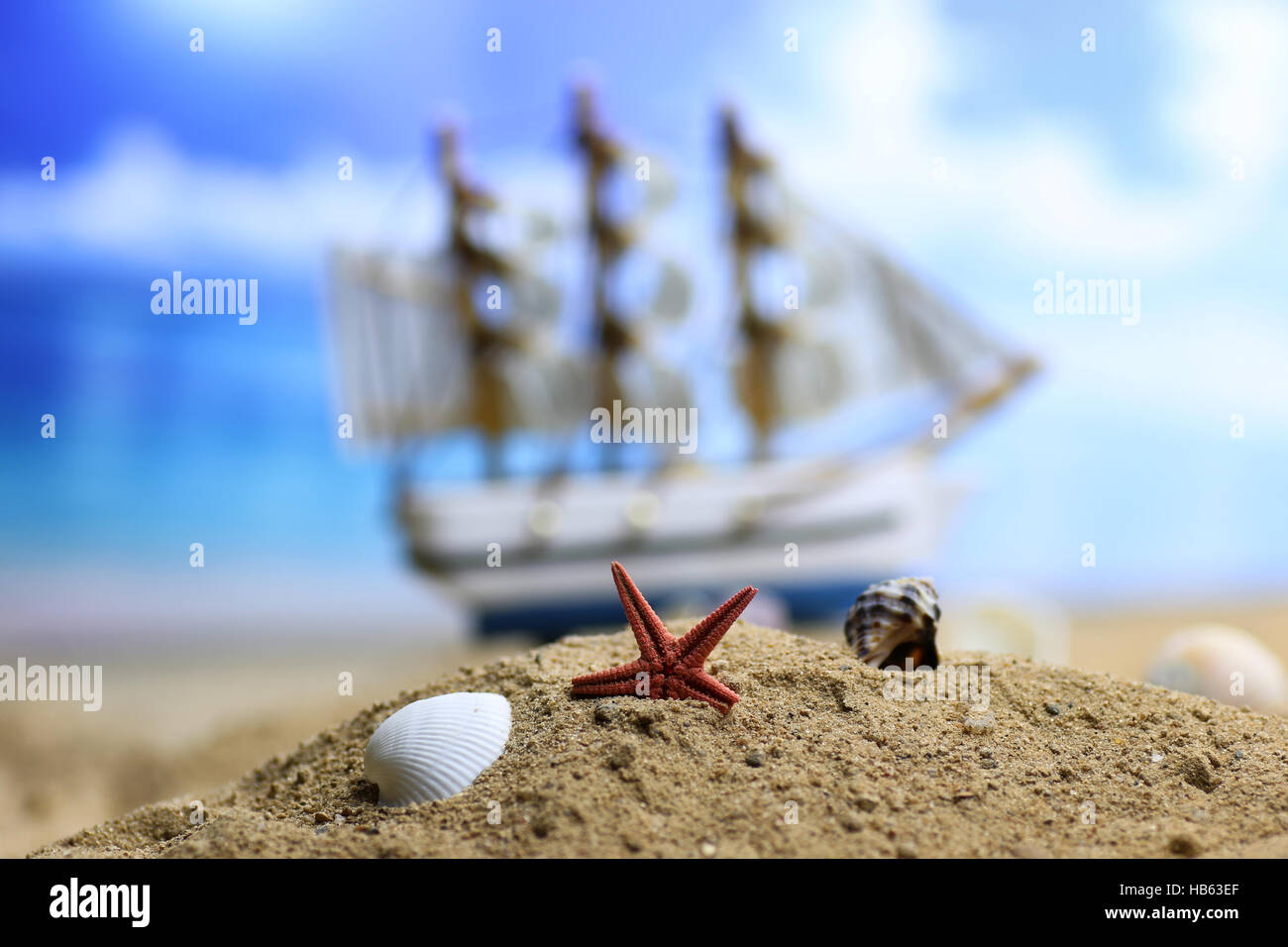 sand shell and sail in sea Stock Photo - Alamy