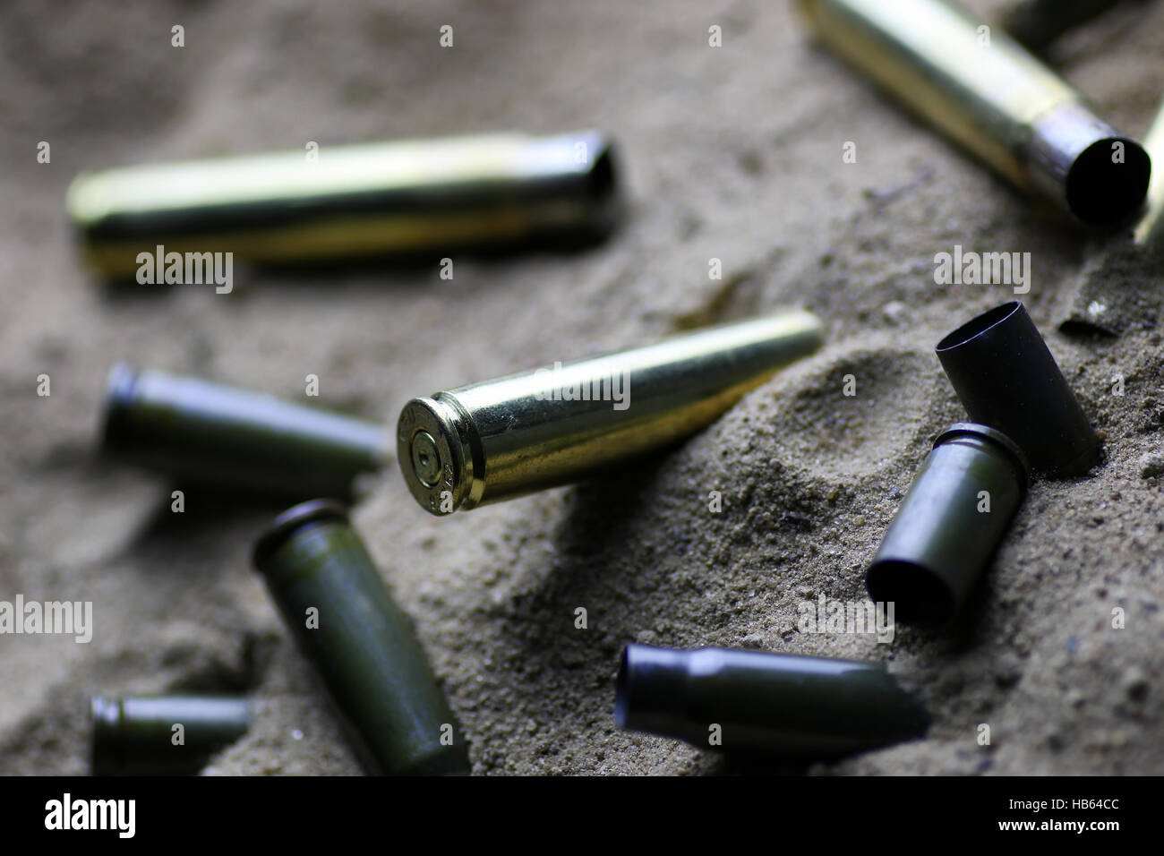 bullet in the sand Stock Photo - Alamy