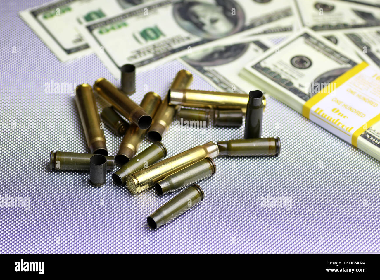 bullet and money dollar on the silver case Stock Photo - Alamy