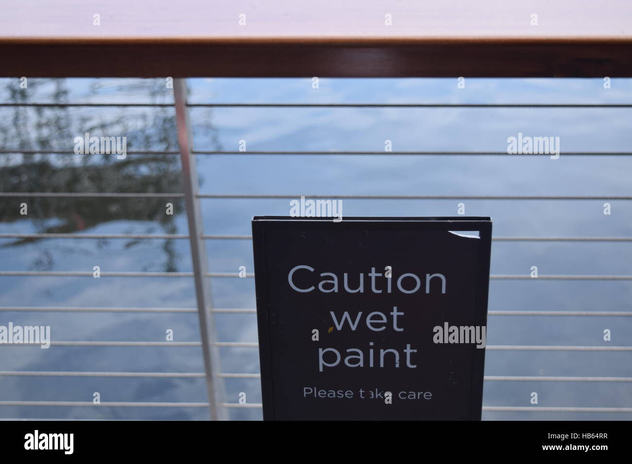 Caution sign on a river background Stock Photo - Alamy