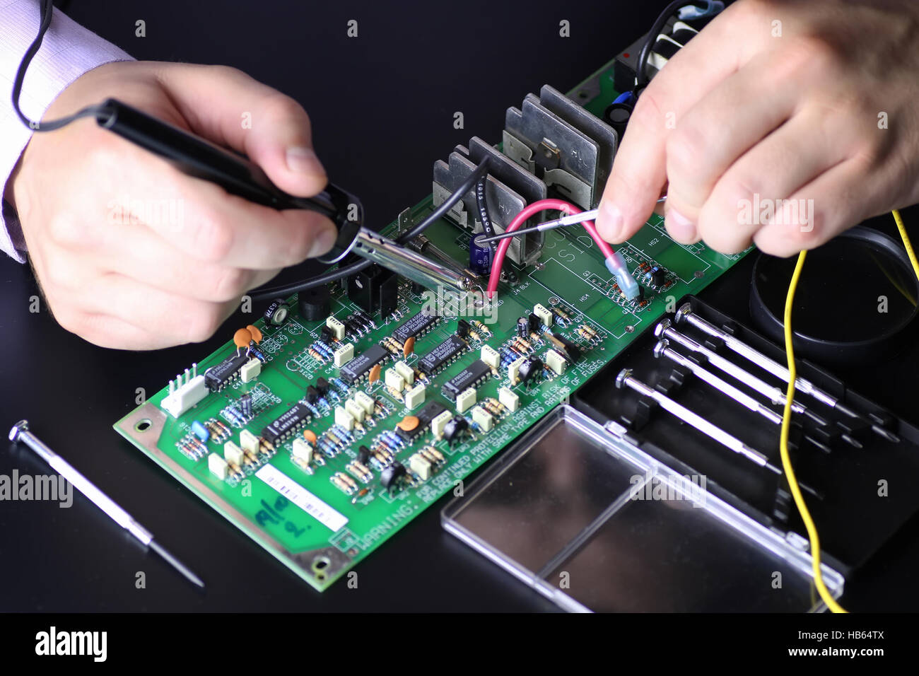 man hands chip soldering tools Stock Photo - Alamy