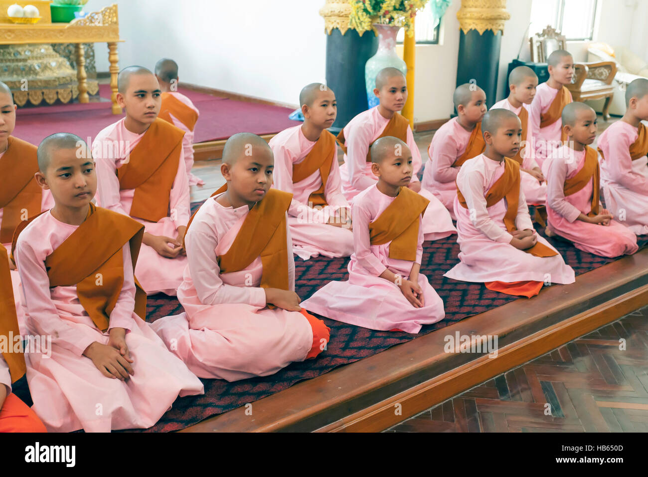 Young buddhist monk in their school in morning prayer hi-res stock ...