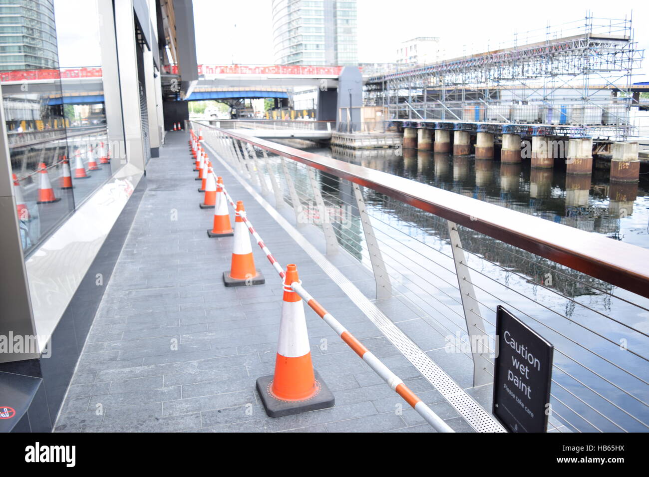 Line of red and white cones on a low bridge Stock Photo - Alamy