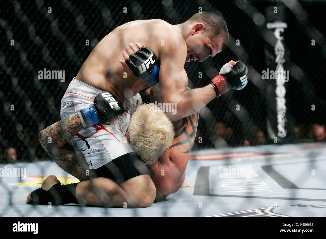 UFC fighter George Sotiropoulos, top, fights Kurt Pellegrino at UFC 116 ...