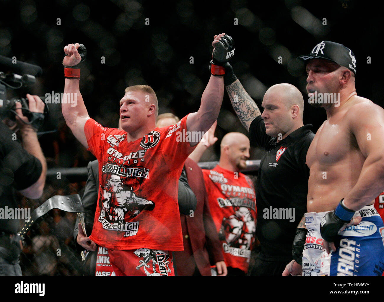 UFC fighter Brock Lesnar, left, celebrates his victory over Shane ...