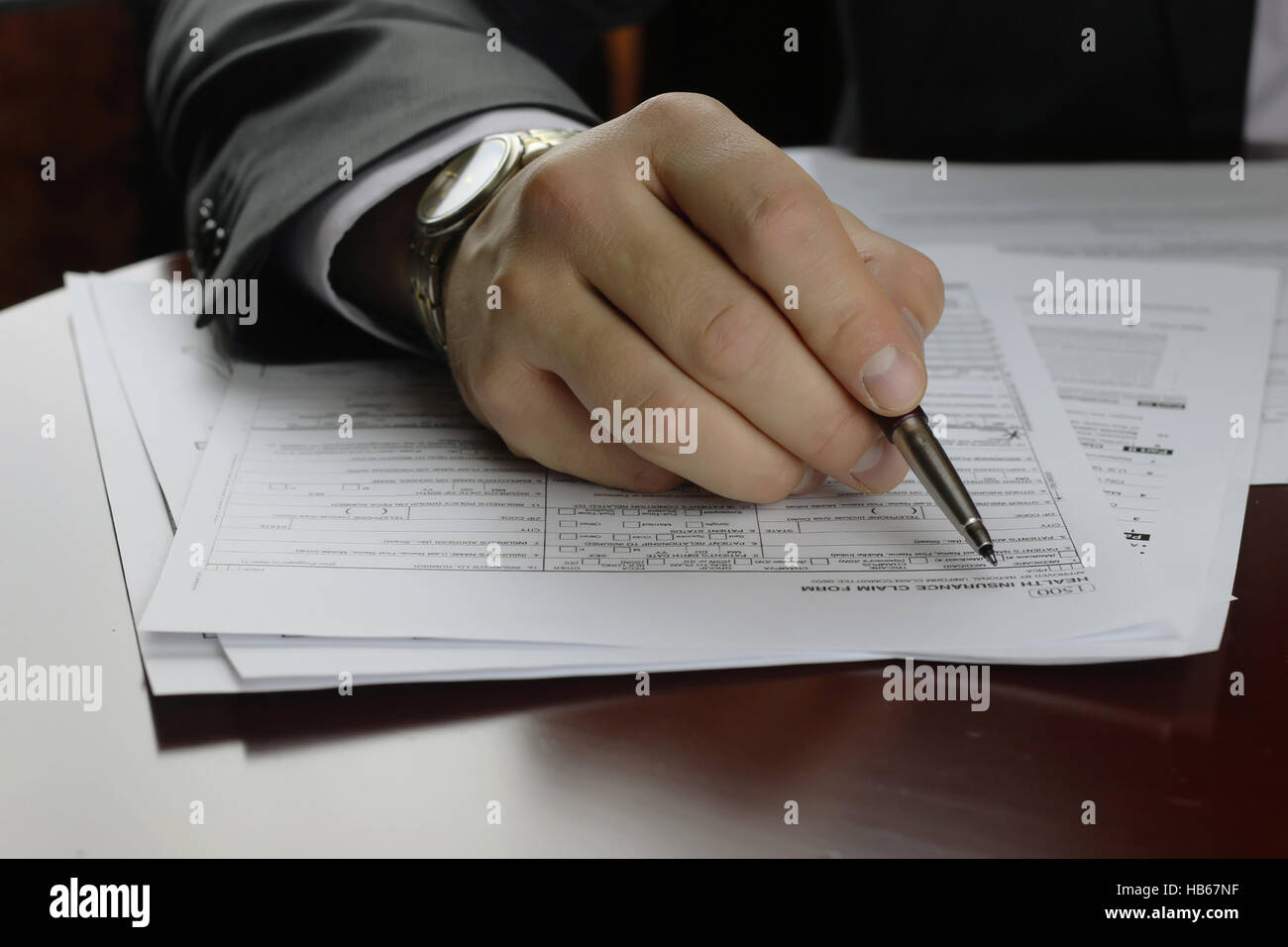 hand signed insurance Stock Photo - Alamy