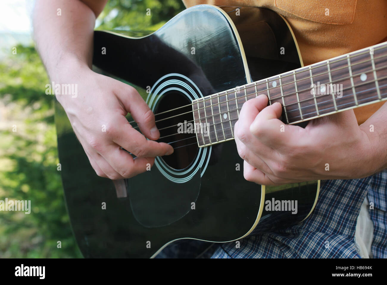 guitar string man hand outdoor Stock Photo - Alamy