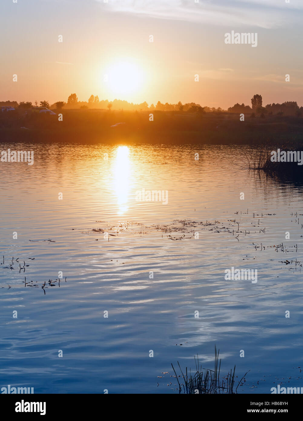Sunset lake view Stock Photo - Alamy