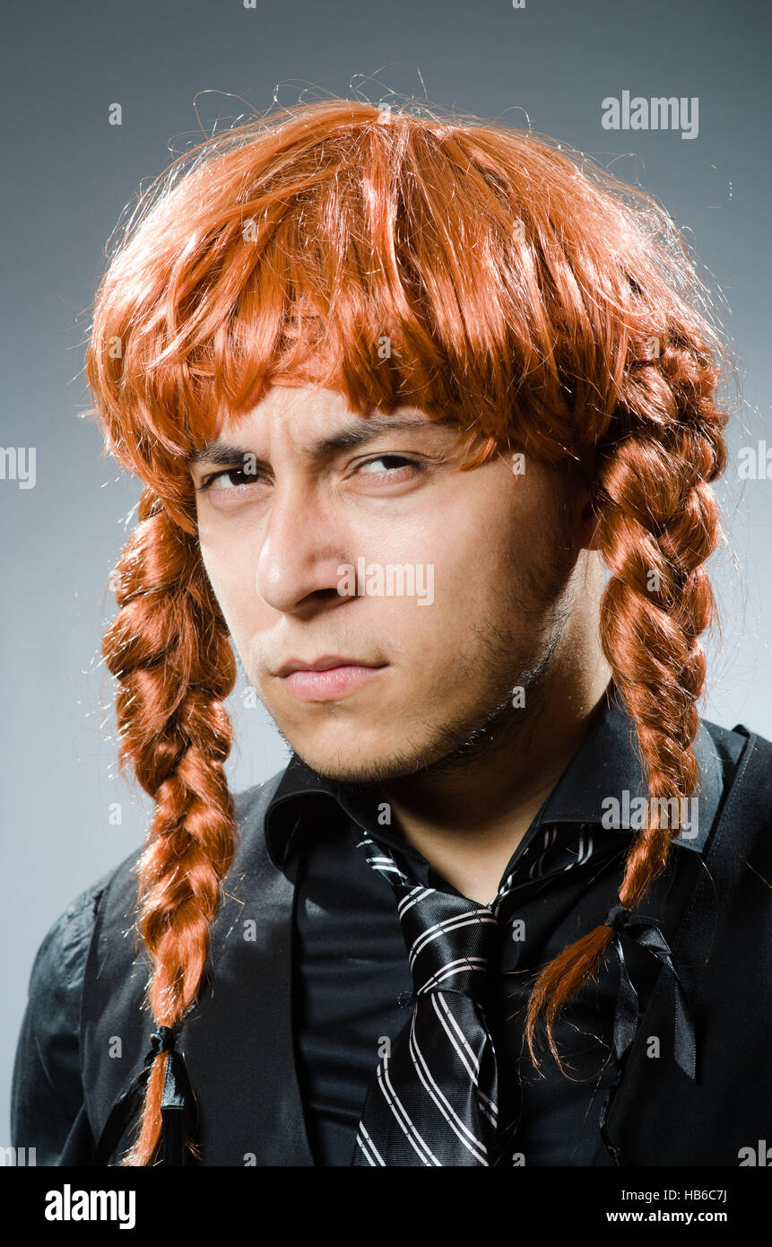 Funny man with red hair wig Stock Photo - Alamy