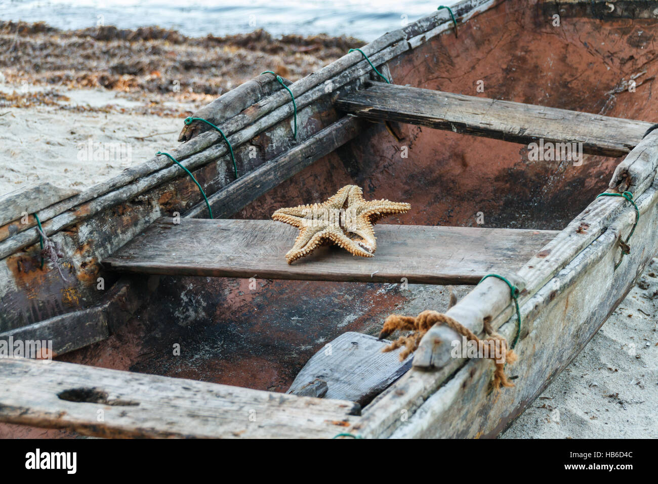Old boat with starfish Stock Photo - Alamy