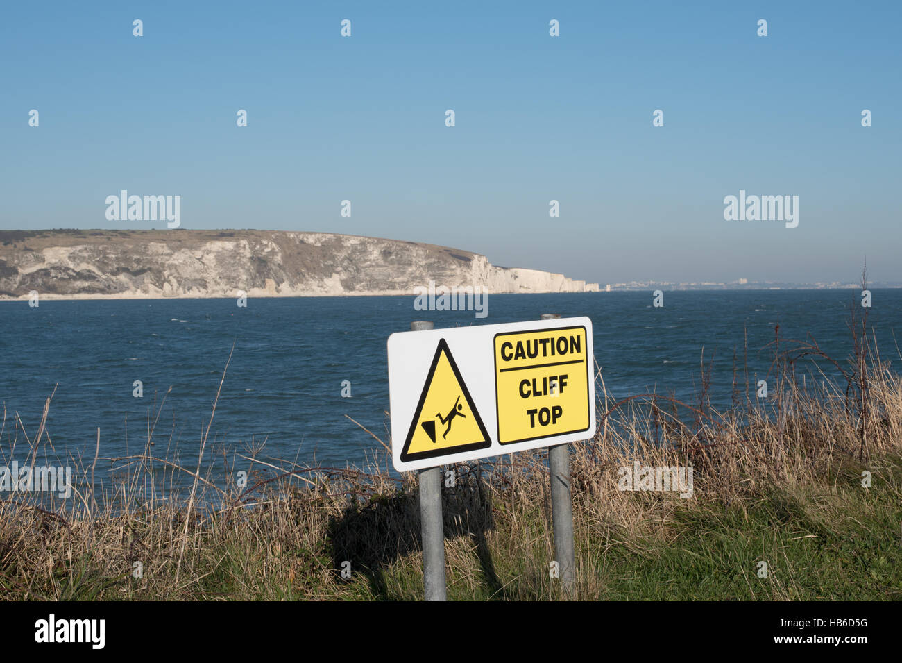Clifftop warning sign at Peveril Point, Swanage Stock Photo - Alamy