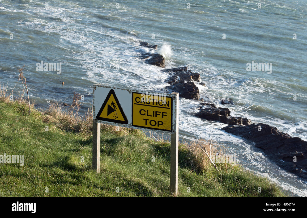 Cliff top warning sign, Peveril Point, Swanage Stock Photo - Alamy