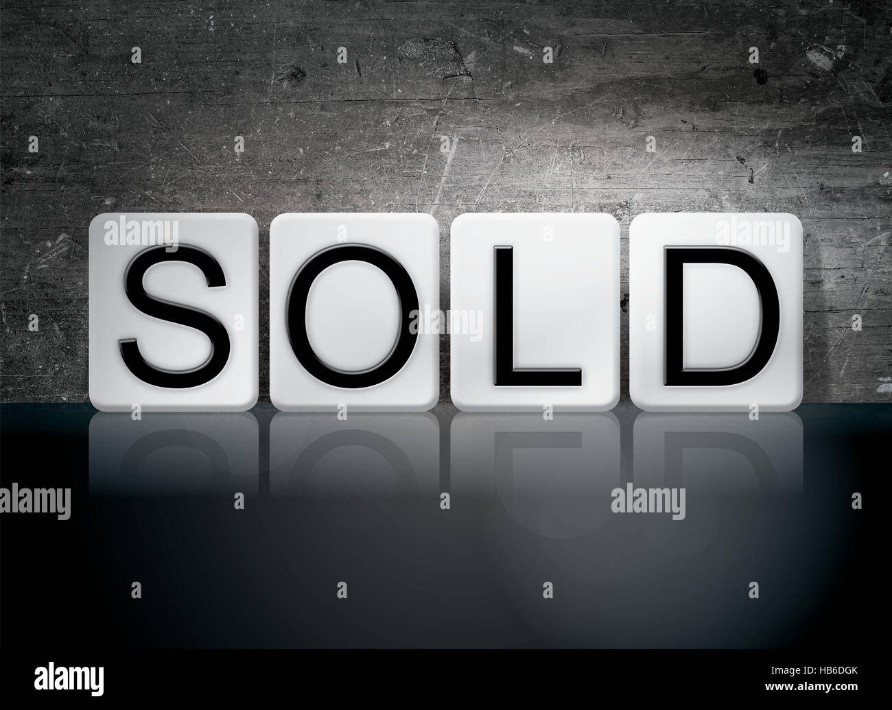 The word "Sold" written in white tiles against a dark vintage grunge ...