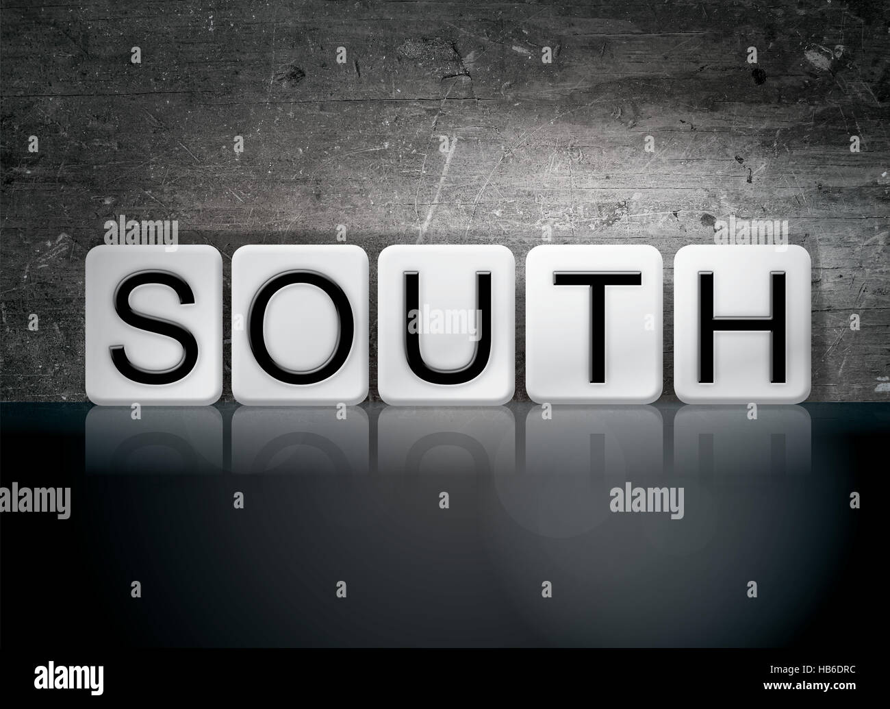 The word "South" written in white tiles against a dark vintage grunge ...