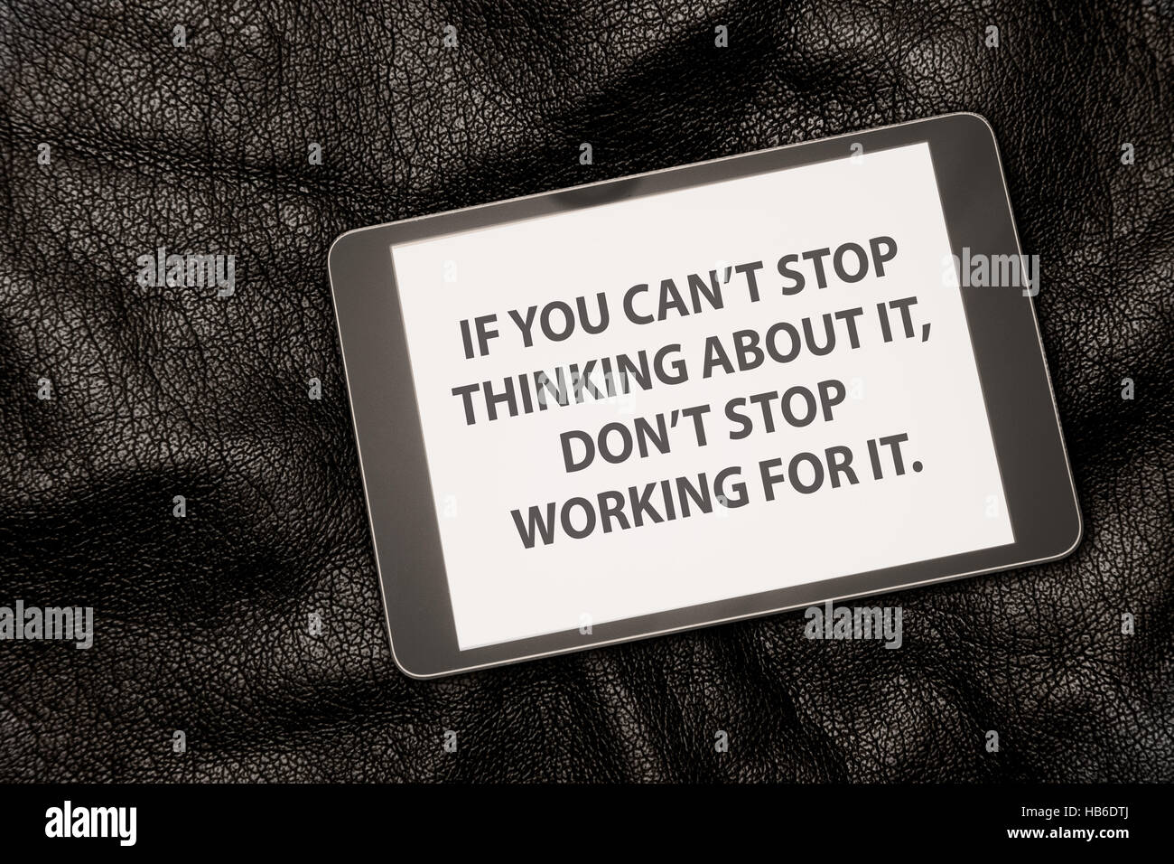 Inspirational Quote on Tablet Stock Photo - Alamy
