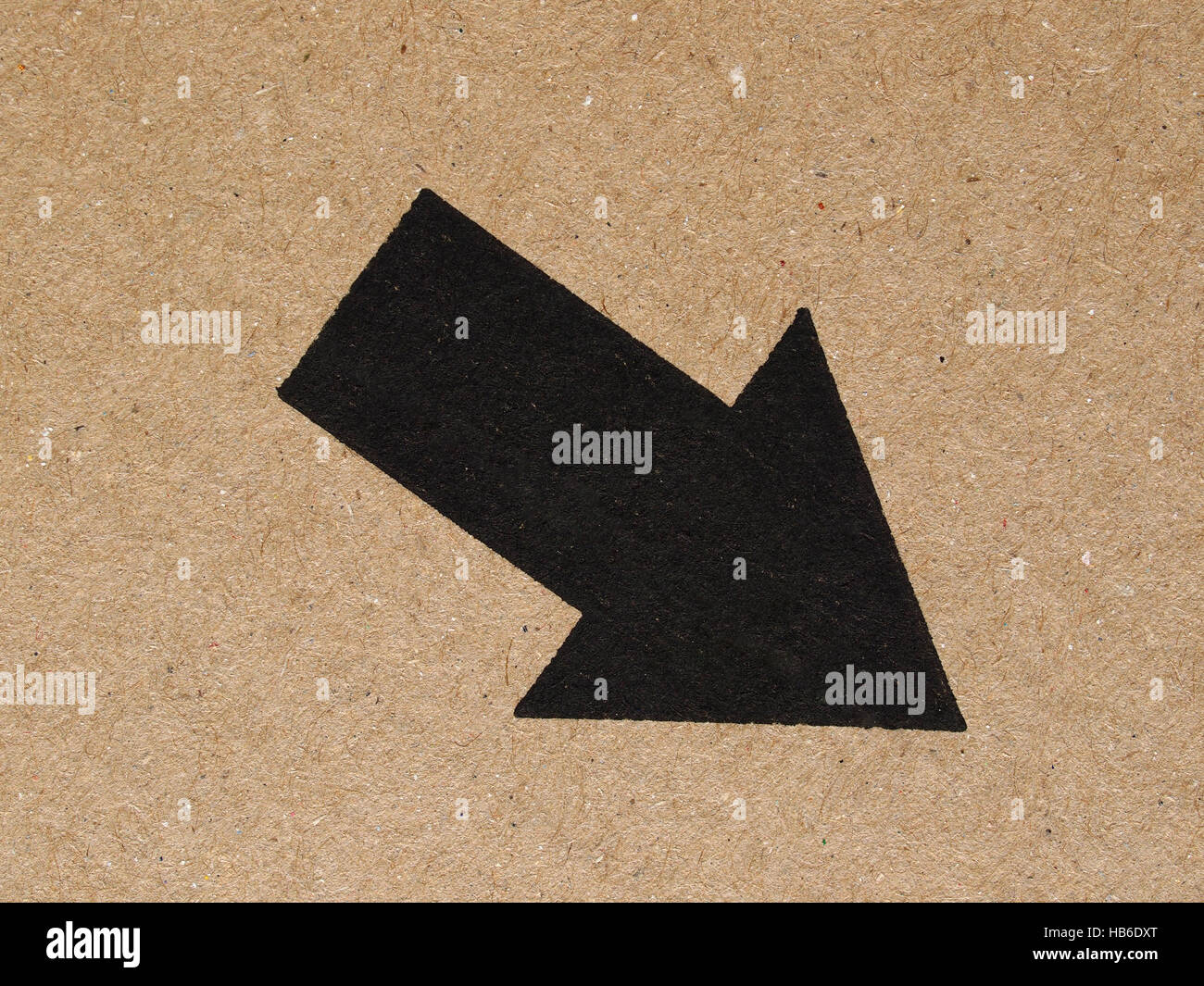 Black arrow on cardboard Stock Photo - Alamy