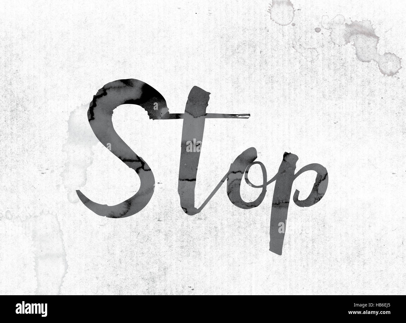 The word "Stop" concept and theme painted in watercolor ink on a white ...