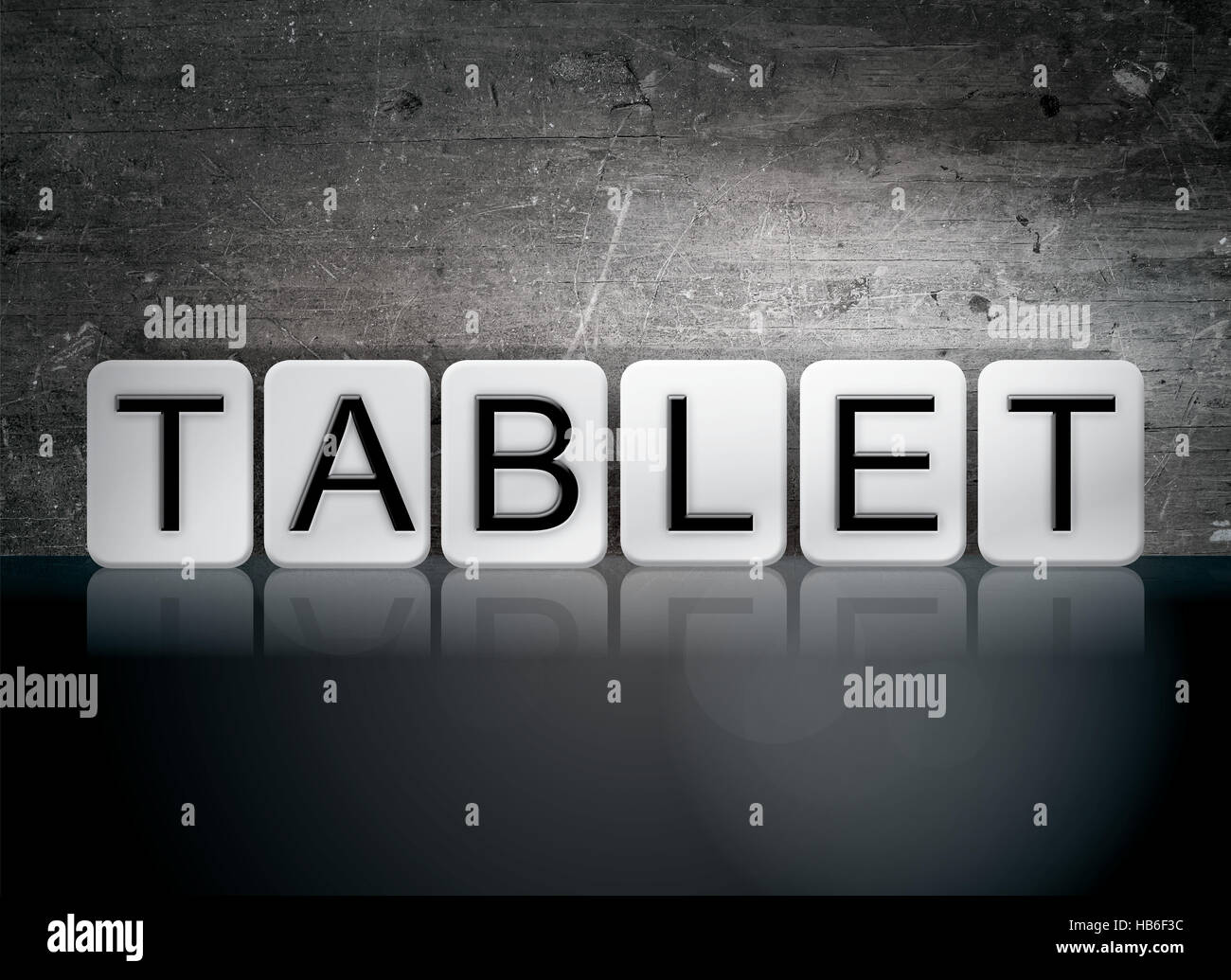 The word "Tablet" written in white tiles against a dark vintage grunge ...