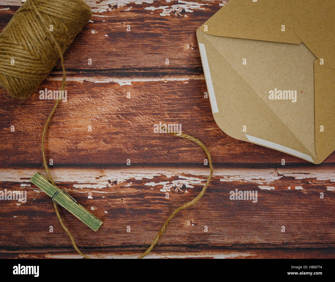 Vintage envelope with pin on wood Stock Photo - Alamy