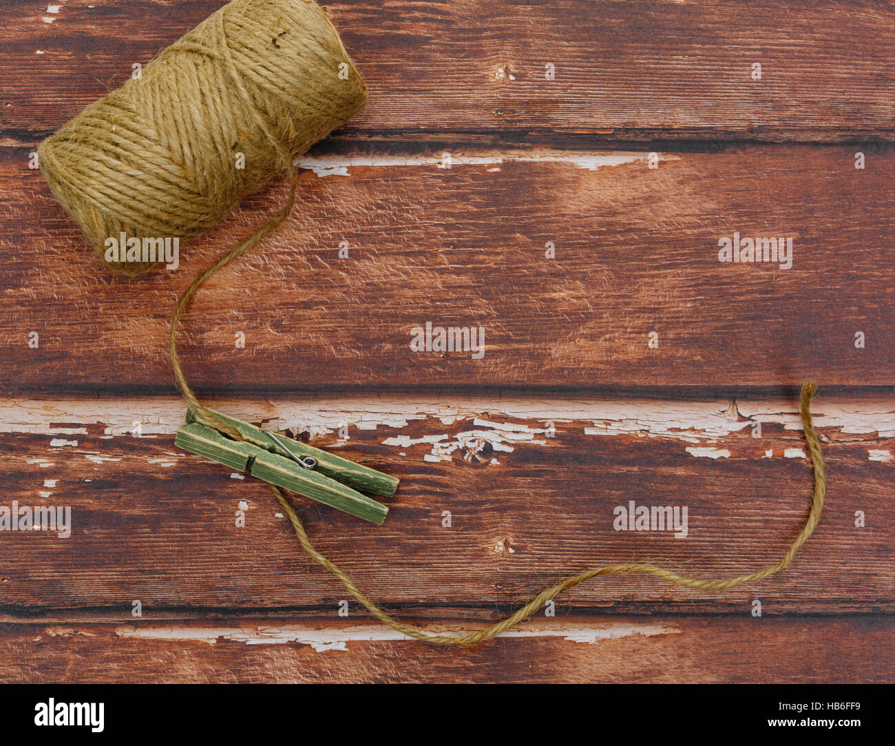 Rough thread reel with pin on wood Stock Photo - Alamy