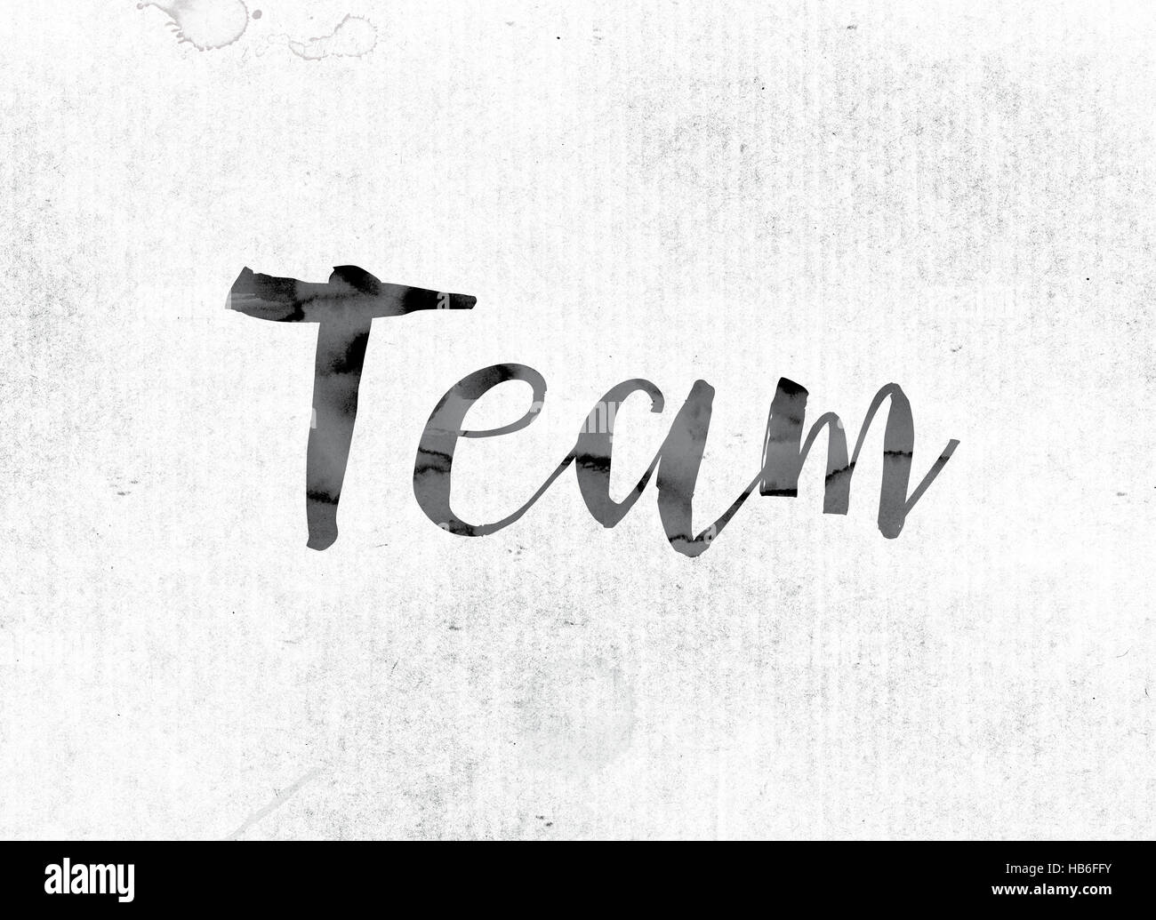 The word "Team" concept and theme painted in watercolor ink on a white ...