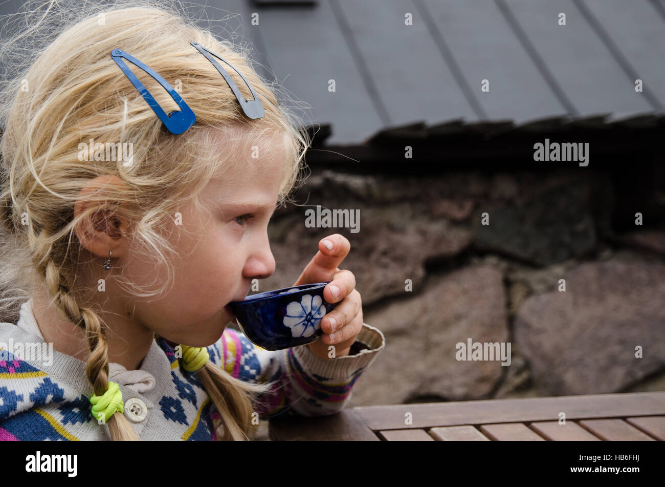 girl drinking tea from ceramics teacup Stock Photo - Alamy