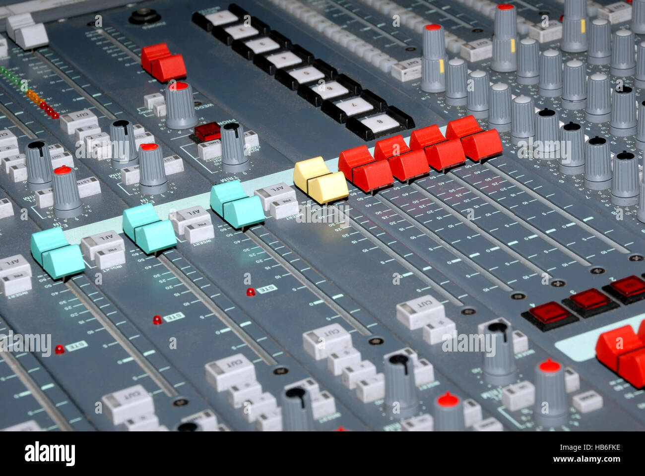 Audio mixing console in a recording studio. Faders and knobs of a sound ...